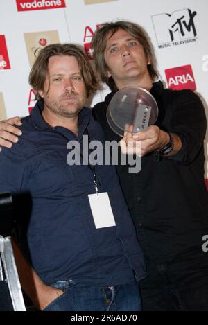 Powderfinger bass player John Collins (left) and lead guitarist Ian ...