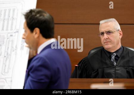 Judge Martin Fein looks at a witness during testimony during the trial ...