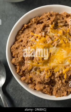 Mexican Homemade Refried Beans with Shredded Cheese Stock Photo - Alamy