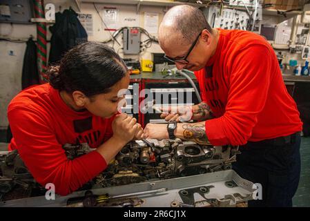 U.S. Navy Aviation Ordnanceman Airman Jessica Fulcher installs a ...