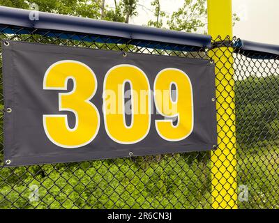 309 foot ft baseball field distance sign in yellow and black mounted on ...