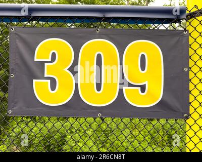 309 foot ft baseball field distance sign in yellow and black mounted on ...