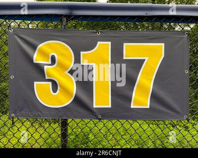 317 foot ft baseball field distance sign in yellow and black mounted on ...