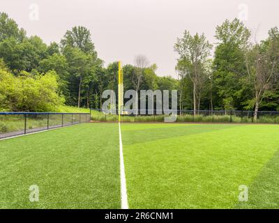 Synthetic turf baseball field with alternating green panels Stock Photo - Alamy