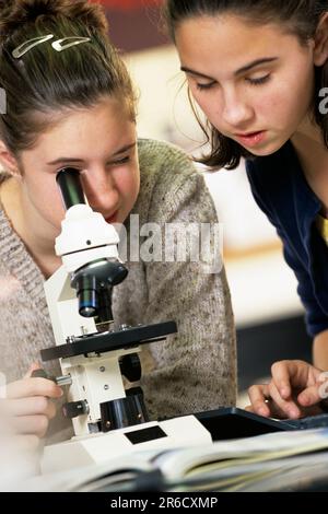 Biology science for girl. school girl with microscope. girl student ...