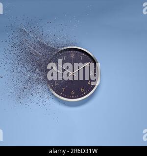 Flow of time. Analog clock dissolving on light blue background Stock ...