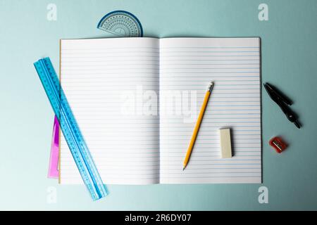 Close up of notebook with rulers and writing material on white ...
