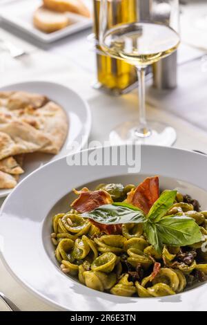 Orecchiette con pesto genovese e speck tirolese, Italian pasta with ...