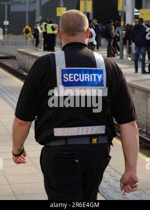 Security guard photographed at Manchester Metrolink tram platform ...