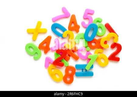 Magnetic multi-coloured figures on purple background. Back to school ...