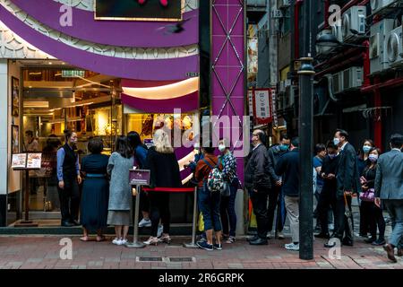 Customers queue outside at a restaurant in Crab island, Malaysia. A ...