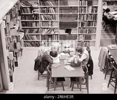 Young women in a vintage library Stock Photo - Alamy