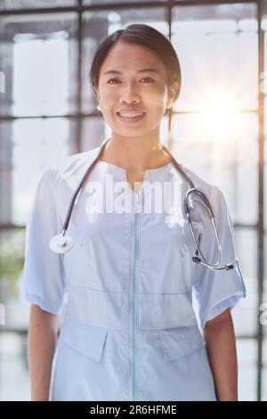 Asian female doctor or medical student examines brain anatomy model for ...