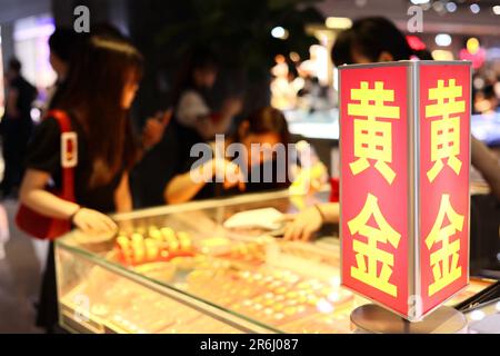 SHENZHEN, CHINA - JUNE 9, 2023 - Consumers shop for gold jewelry at the ...