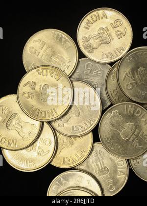 closeup of vintage 5 or five rupee gold coins of india arranged in a ...