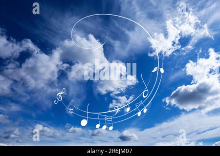 Treble clef and swirly staff with musical notes against sky Stock Photo ...
