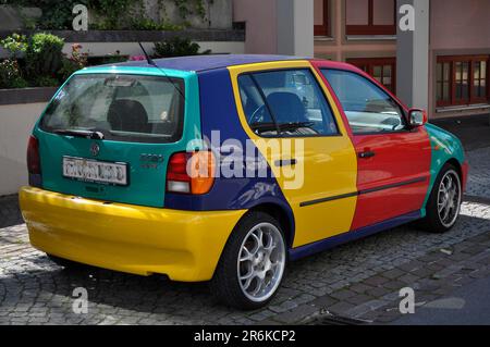 Four-coloured car, VW Polo Harlequin Stock Photo - Alamy