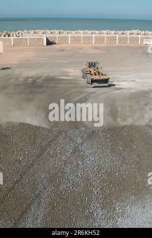 Excavator Loading Cement at Laayoune Port's Diverse and Bulk Quay Stock ...