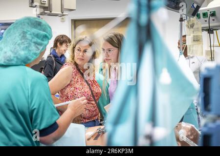 GRONINGEN - Visitors look around in an operating room in the University ...