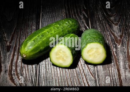 Green Sliced cucumber on the wood background Stock Photo - Alamy