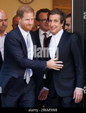 Lawyer David Sherborne (C) leaves the High Court today following the ...