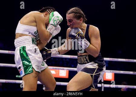 Ellie Scotney (right) hits out at Cherneka Johnson during the IBF Super ...