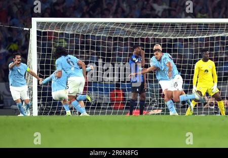Manchester City's Rodri (second right) scores their side's first goal ...