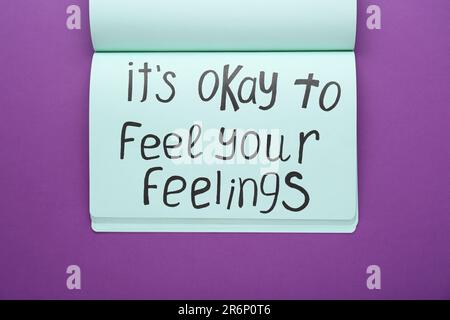 Notebook with phrase It`s Okay To Feel Your Feelings and paper cutout ...