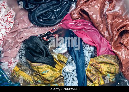 Laundry soaked in water is ready for washing procedure Stock Photo - Alamy