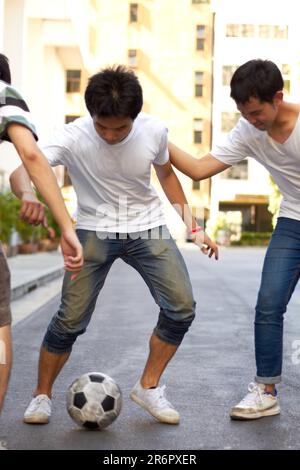 Happiness asian soccer player with excited expression Stock Photo - Alamy