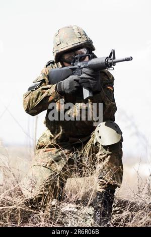 The man in the field with a machine gun, Ukrainian men are preparing ...
