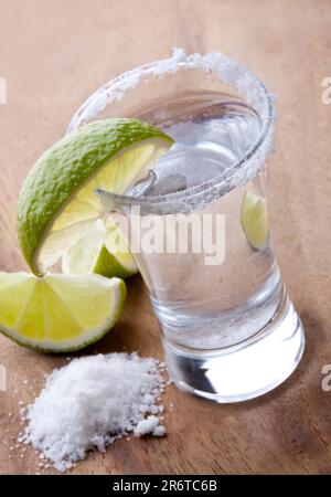 shot glass filled with clear cold alcohol Stock Photo - Alamy