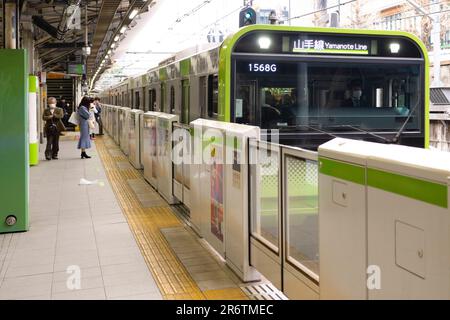 Editorial use only JR Yamanote line train approaching the platform at ...