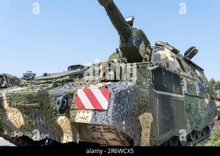 A modern Panzerhaubitze 2000 camouflage armored self-propelled howitzer ...