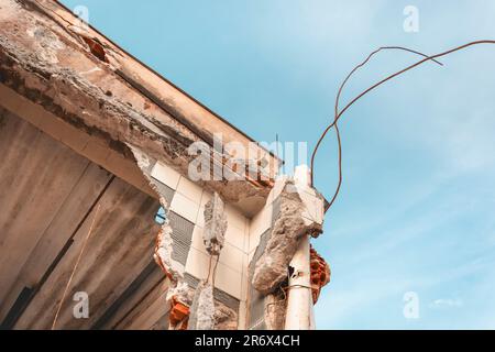 Image of a building under demolition. Concrete, bricks and steel beams ...
