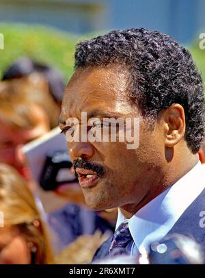 Democratic presidential candidate Jesse Jackson, left, watches his son ...