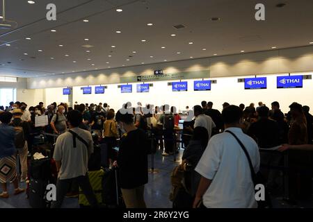 Passengers of Thai Airways flight TG683 going through the formalities ...