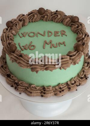 frosted icing elegnt cake with funny lettering topping. Mothers day ...