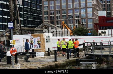 Irish construction workers working at a sight of a new building along ...