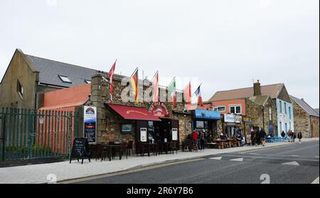 The Oar house and Octopussy restaurant on the pier of Howth, Ireland ...