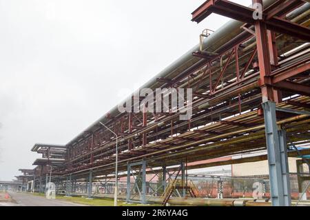 Industrial trestle for pipes. Iron pipes in the oil refinery ...