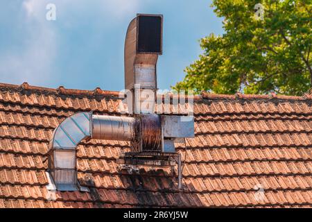 Fast food restaurant chimney extractor on the roof, selective focus ...