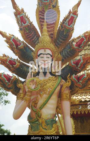 Statue of a standing angel with a serpent covering the back, guarding ...