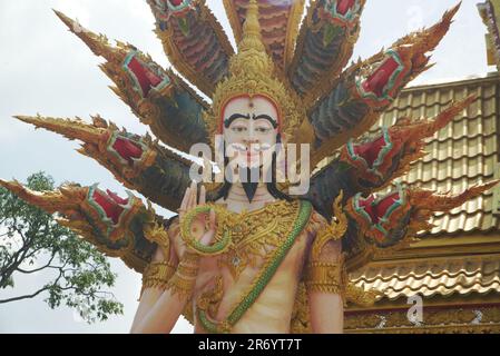 Statue of a standing angel with a serpent covering the back, guarding ...