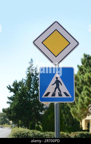 Traffic signs / pedestrian crossing and priority road Stock Photo - Alamy