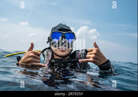 diver floating on the surface after a dive in the Maldives Stock Photo ...