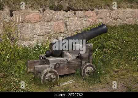 Old classic canon with wheels in stone fortress Stock Photo - Alamy