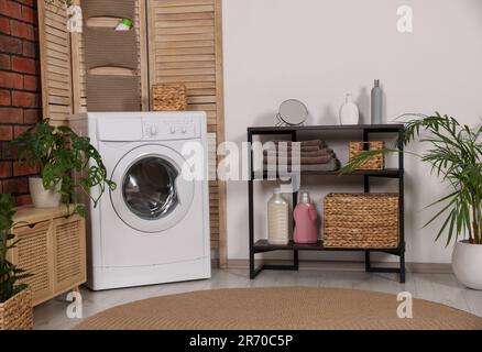 Stylish laundry room with washing machine. Interior design Stock Photo ...