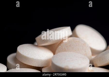 Open and unpacked tablets close-up, a large number of identical medical ...