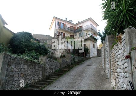 Itri, Italy. Steep alleyway with stone steps in the Old Town. View of ...
